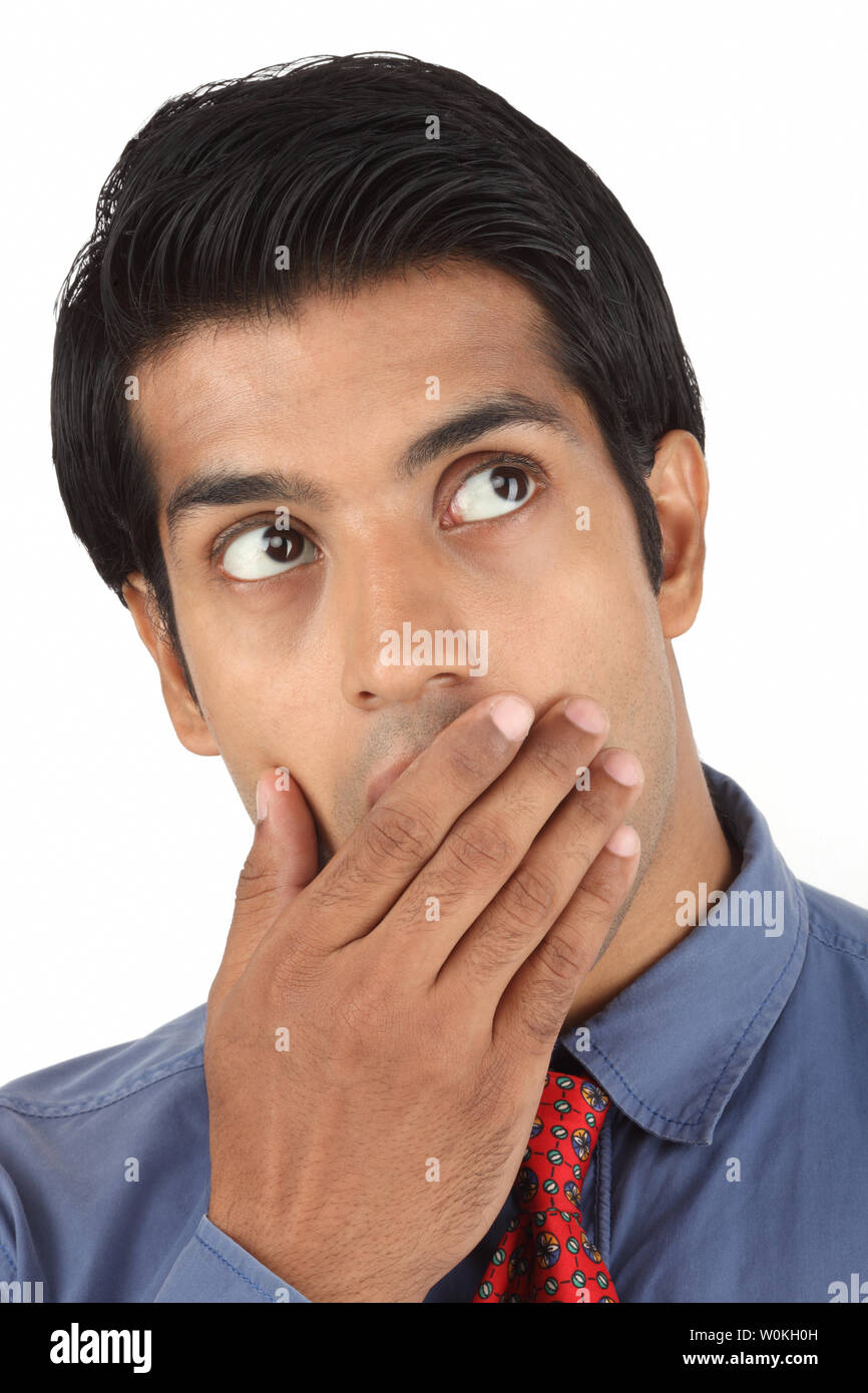 Indian young businessman looking shocked Stock Photo - Alamy