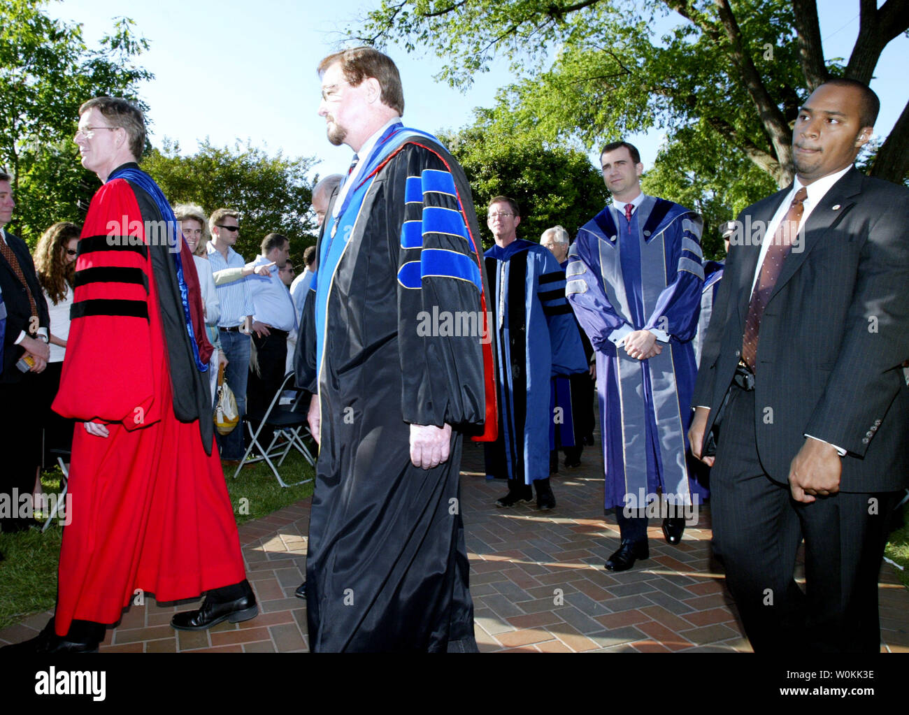 Spanish Crown Prince Felipe (2nd L) follows his bodyguard as he arrives ...
