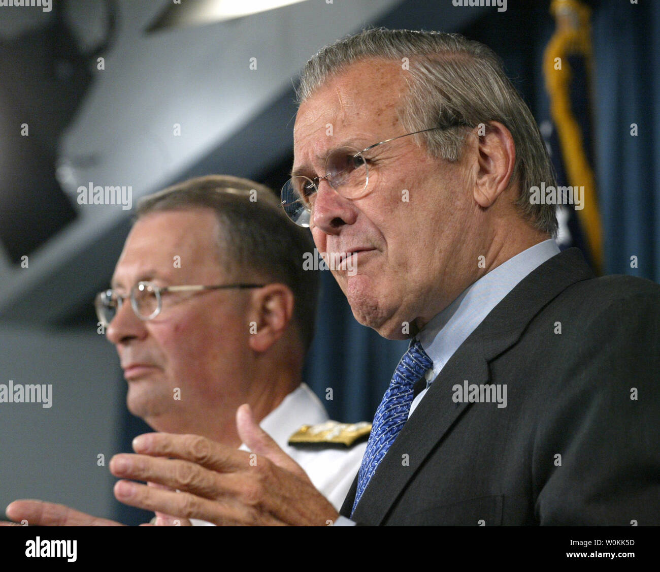 U.S. Secretary of Defense Donald Rumsfeld (R) speaks during a joint ...