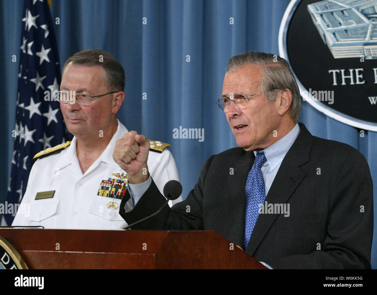 U.S. Secretary of Defense Donald Rumsfeld (R) speaks during a joint ...