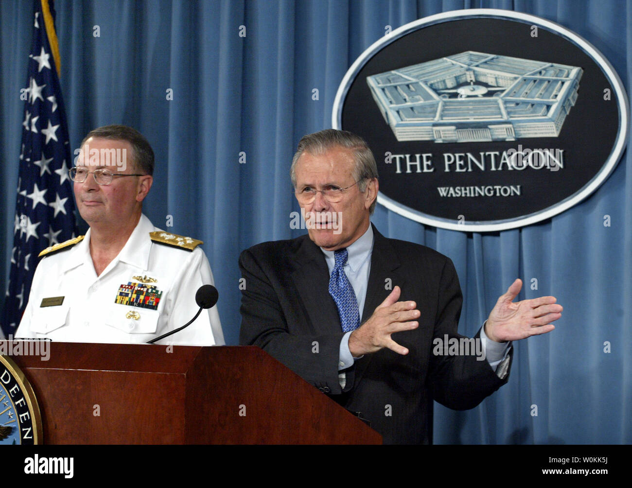 U.S. Secretary of Defense Donald Rumsfeld (R) speaks during a joint ...