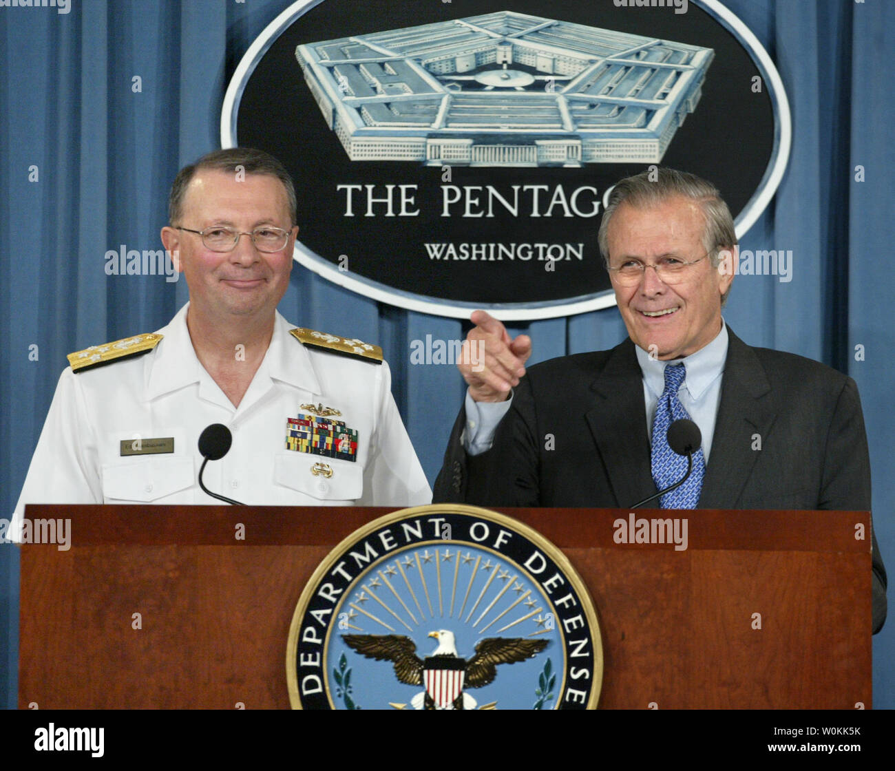 U.S. Secretary of Defense Donald Rumsfeld (R) smiles with Vice Chairman ...
