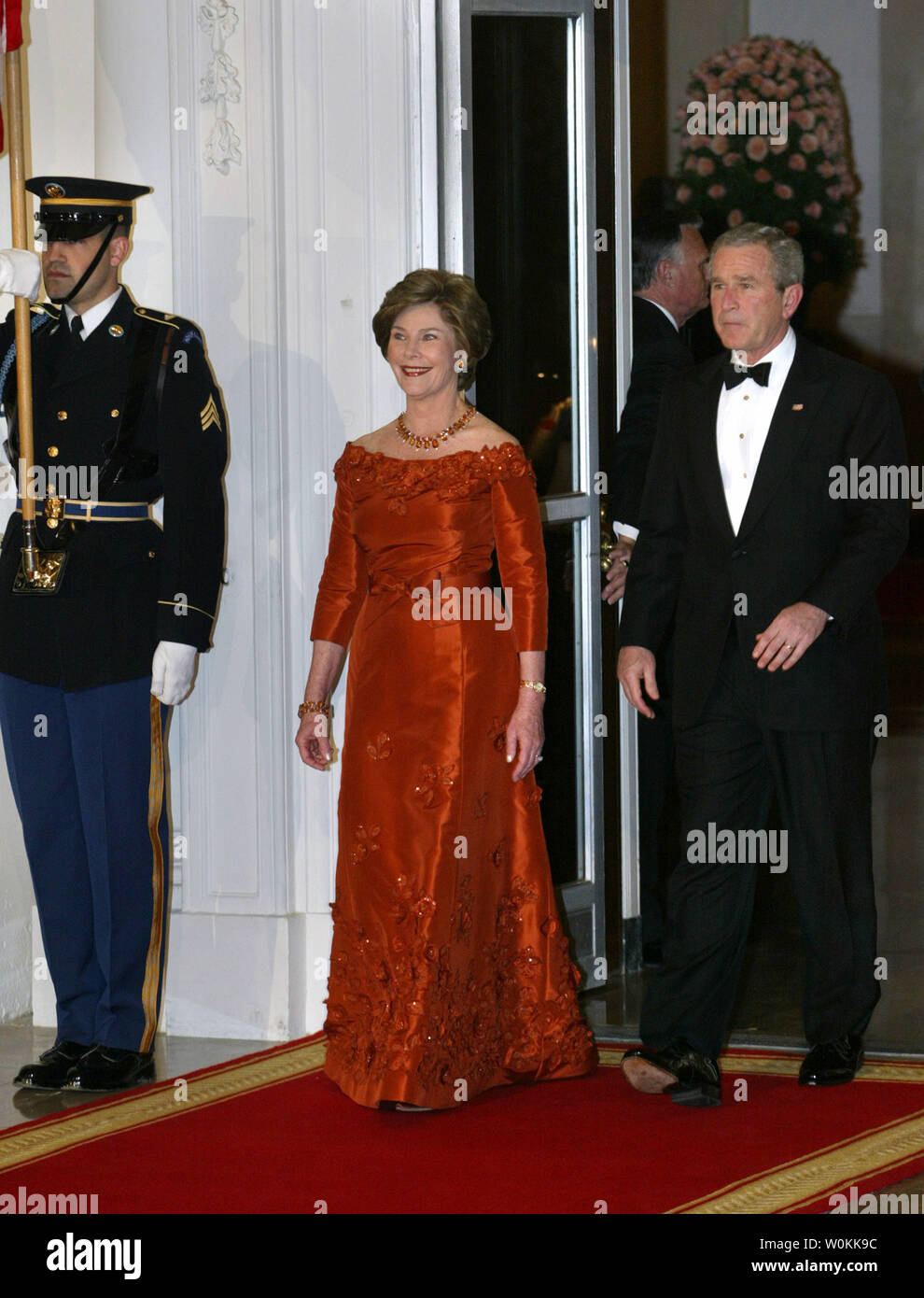 U.S. President George W. Bush (R) and first lady Laura Bush come out to ...