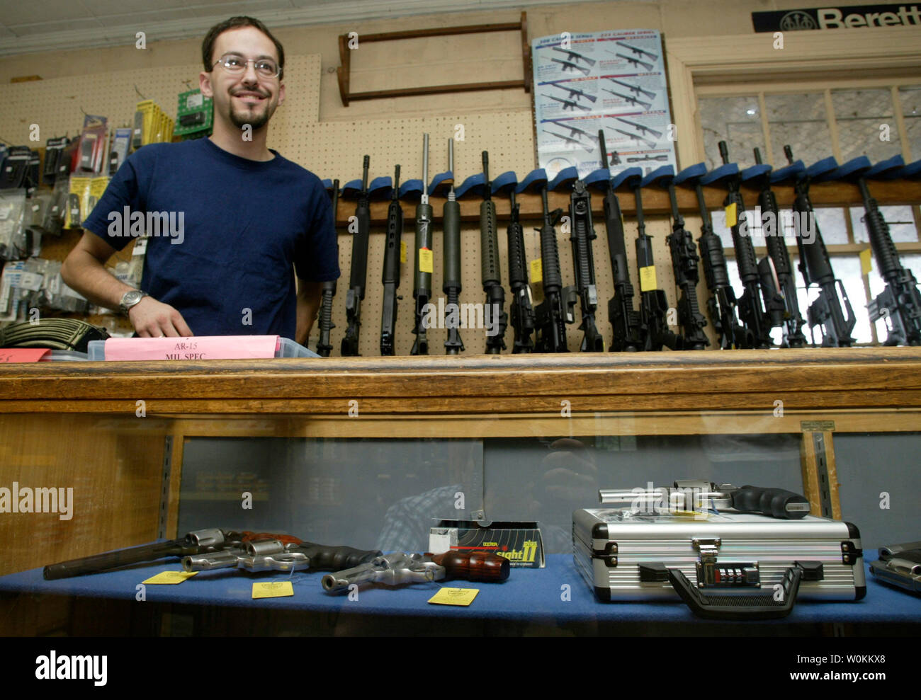 Salesman Ross Pogan demonstrates the Cold Match target gun at the ...