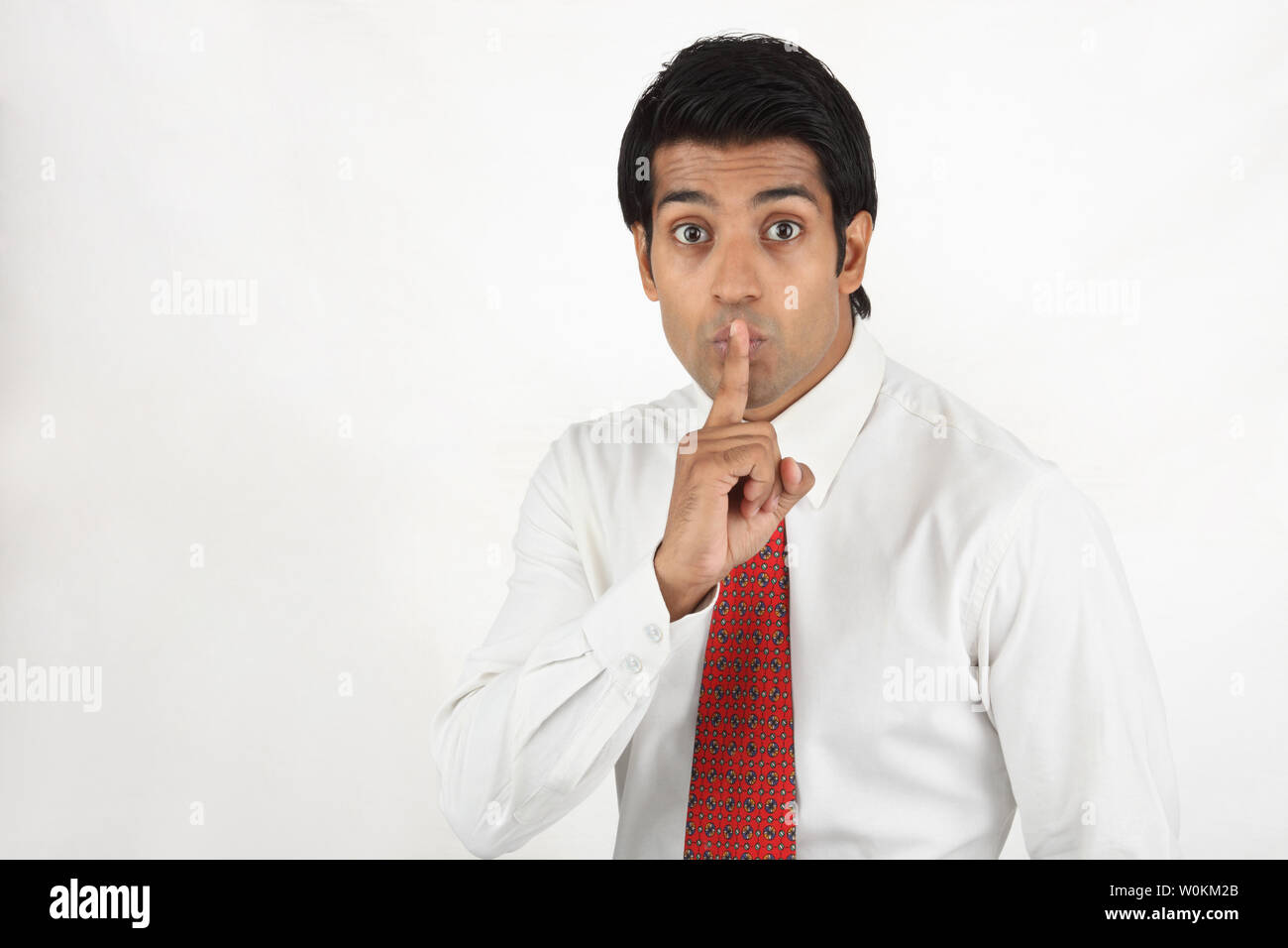Finger on lips india hi-res stock photography and images - Alamy