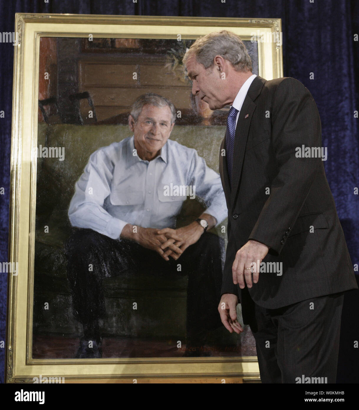 U.S. President George W. Bush looks over his portrait during an ...