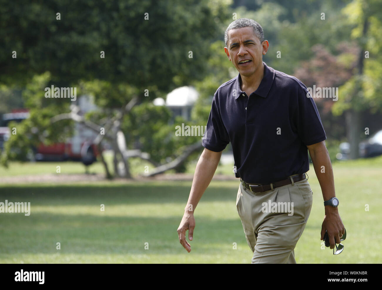U.S. President Barack Obama walks on the South Lawn of the White House ...