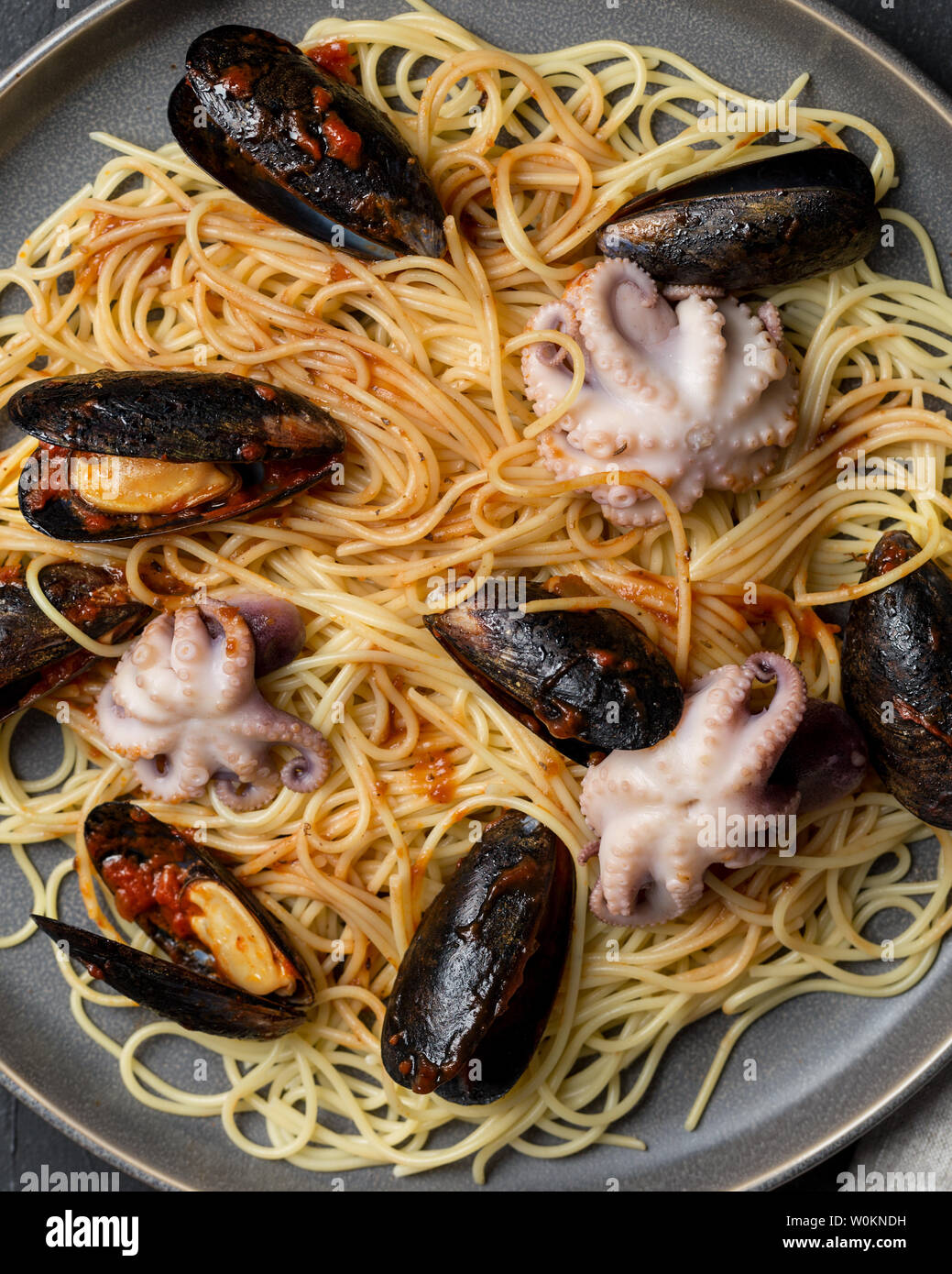 Spaghetti with seafood macro. Octopus and mussels with tomatoes sauce ...