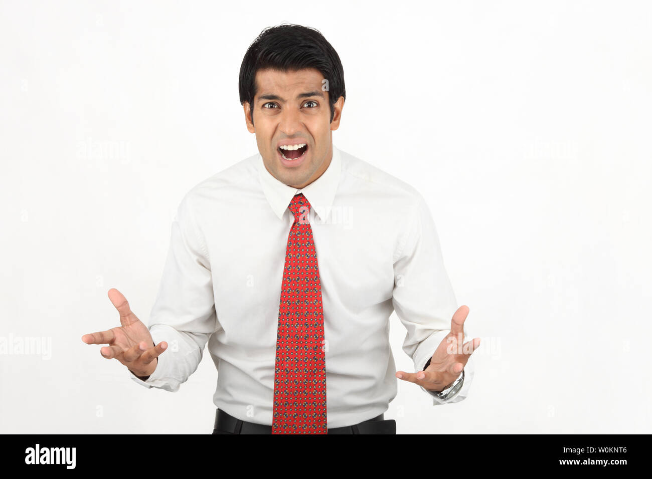 Portrait of a businessman with unhappy questioning look Stock Photo - Alamy