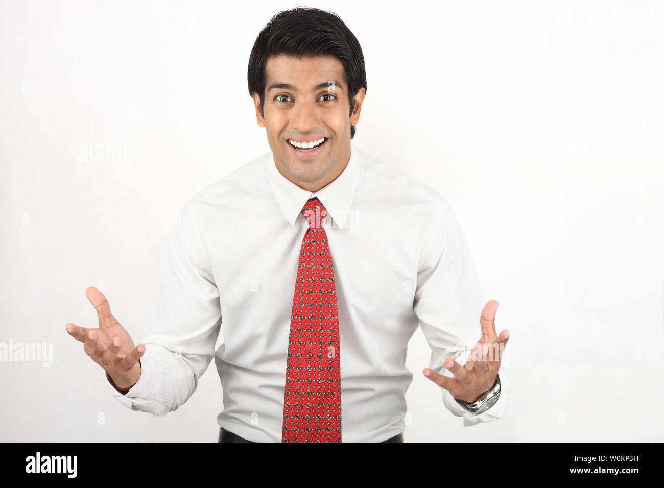 Portrait of a businessman with happy questioning look Stock Photo - Alamy
