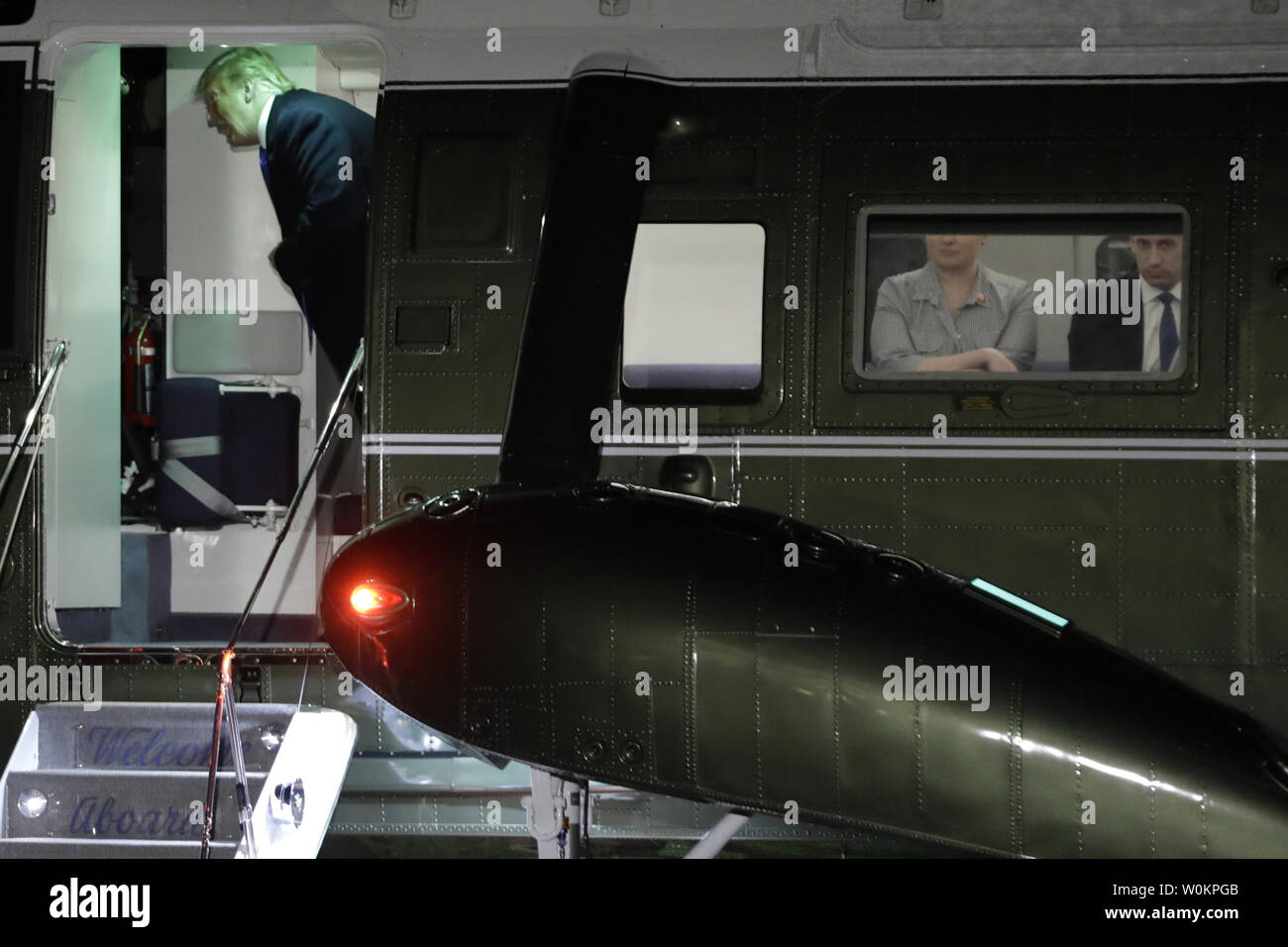 U.S. President Donald Trump greets Marine One pilots as he arrives on ...