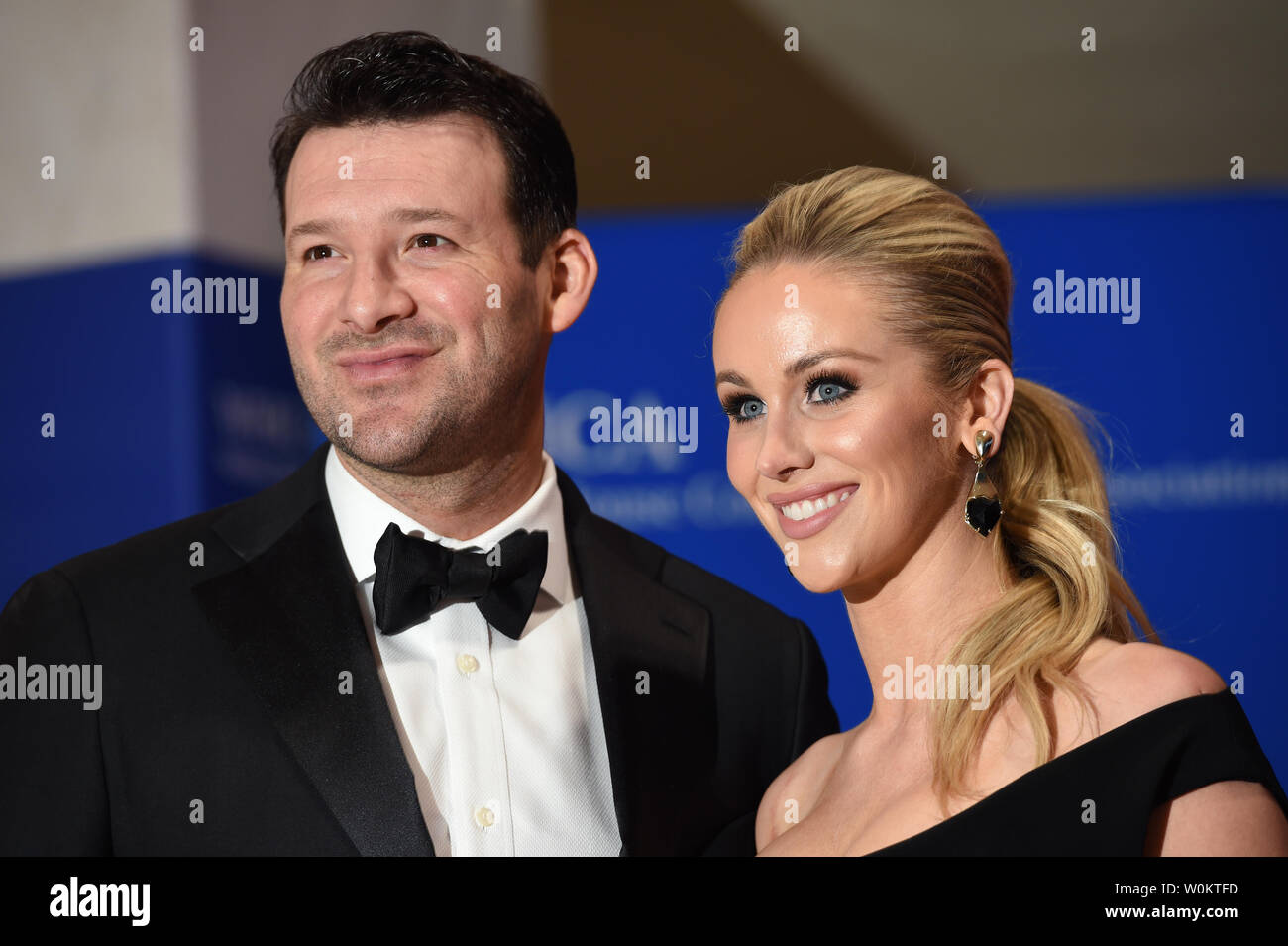 Tony Romo and his wife Candace Crawford- Romo arrive on the red carpet ...