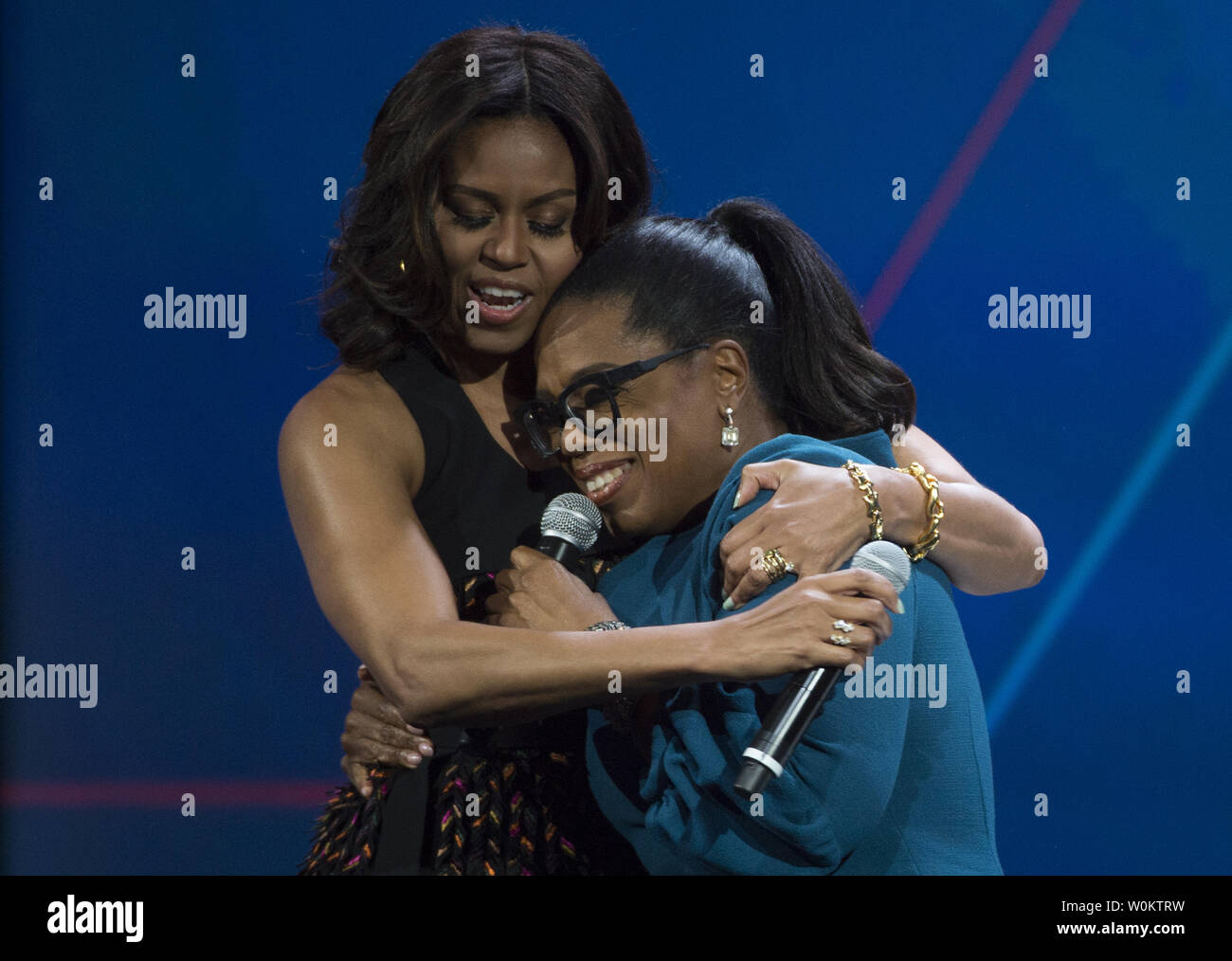 First lady Michelle Obama hugs Oprah Winfrey after they spoke at the ...