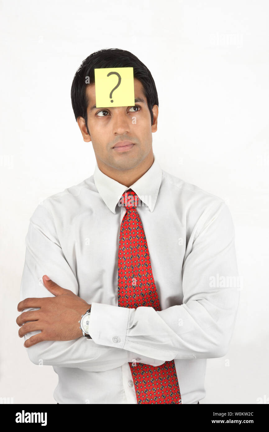 Businessman with question mark on adhesive note stuck to forehead Stock ...