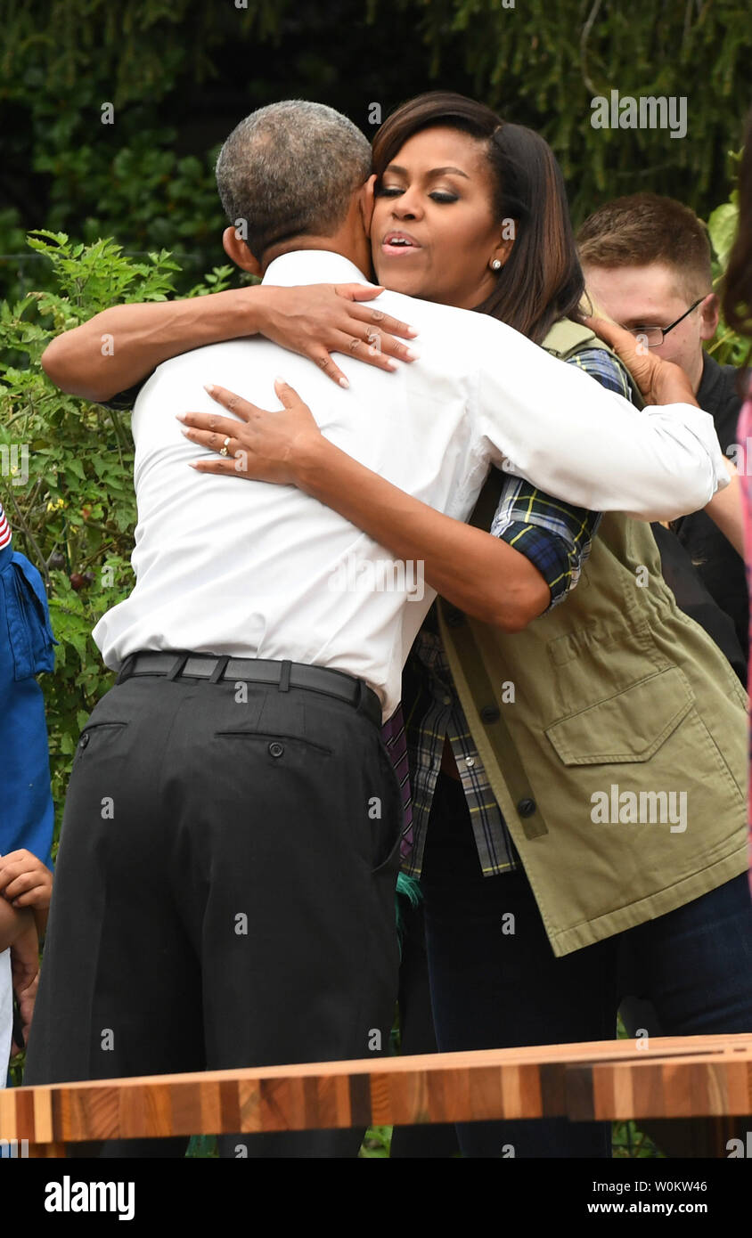 President Barack Obama hugs his wife first lady Michelle Obama after ...