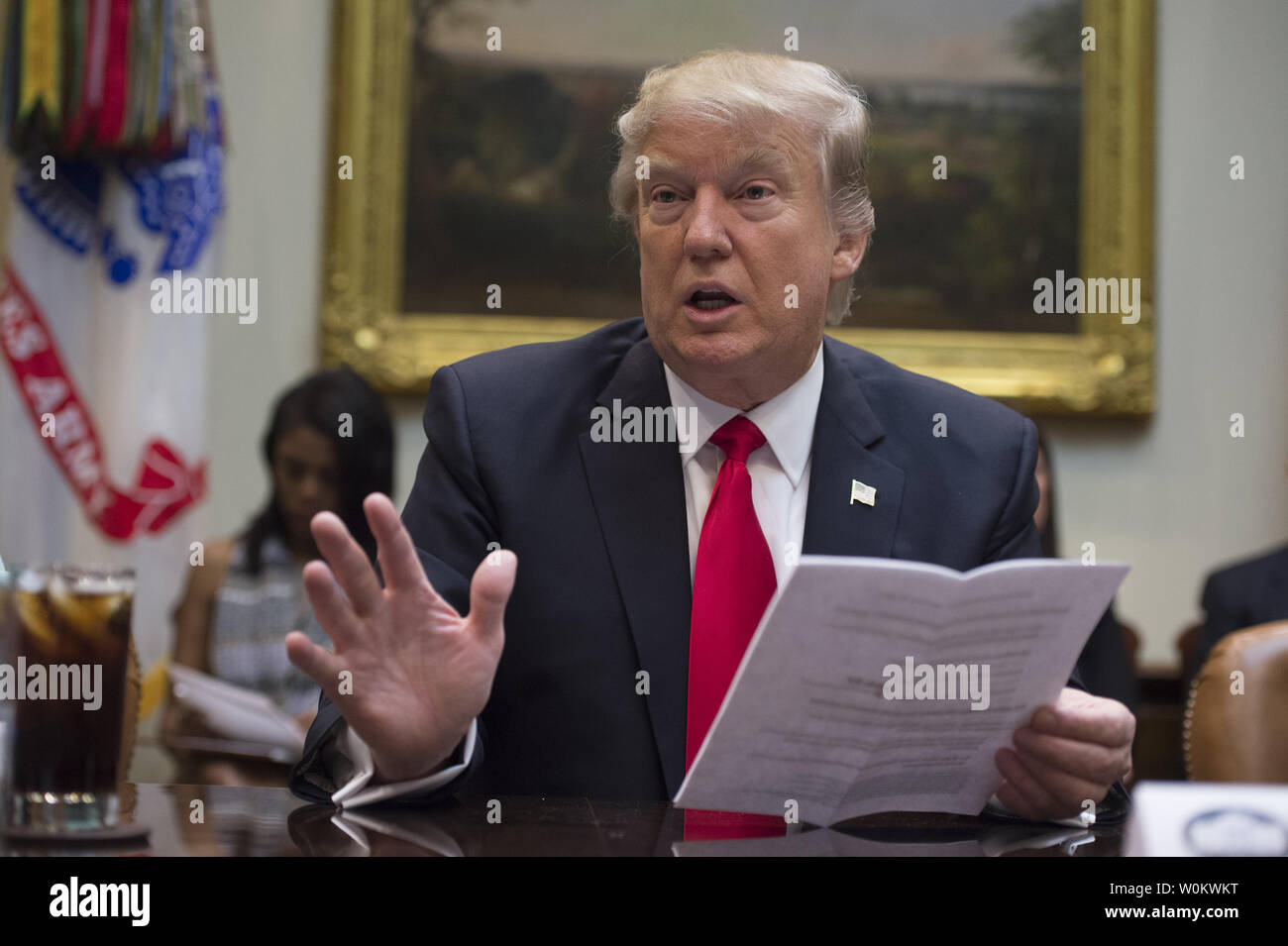 President Donald Trump holds a breakfast and listening session with ...
