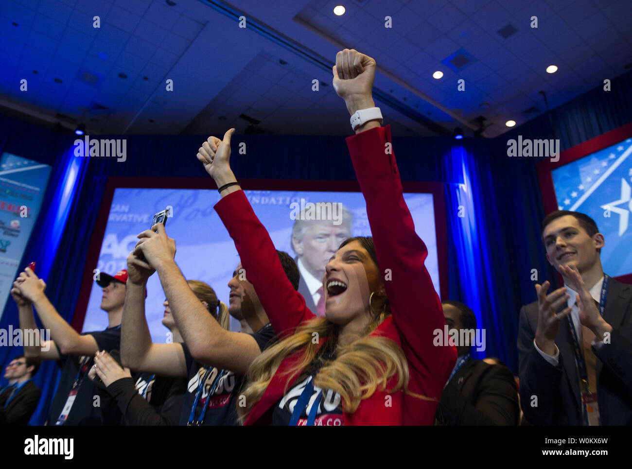 Attendees cheer while U.S. President Donald Trump speaks during the ...