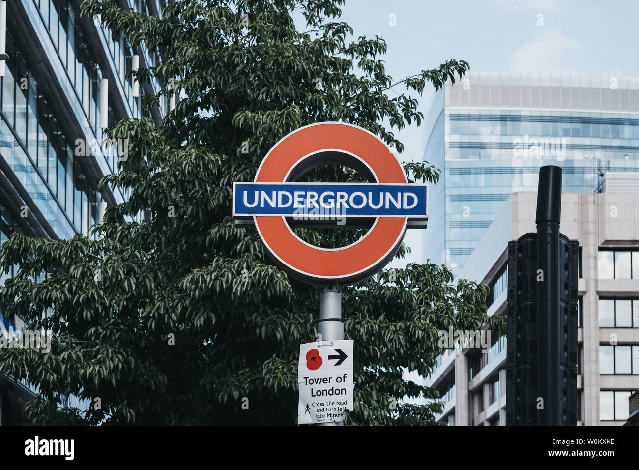 London, UK - June 22, 2019: London Underground sign against trees and ...