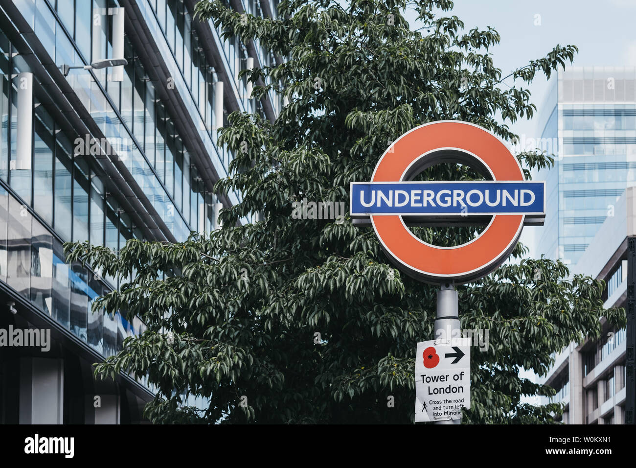 London, UK - June 22, 2019: London Underground sign against trees and ...