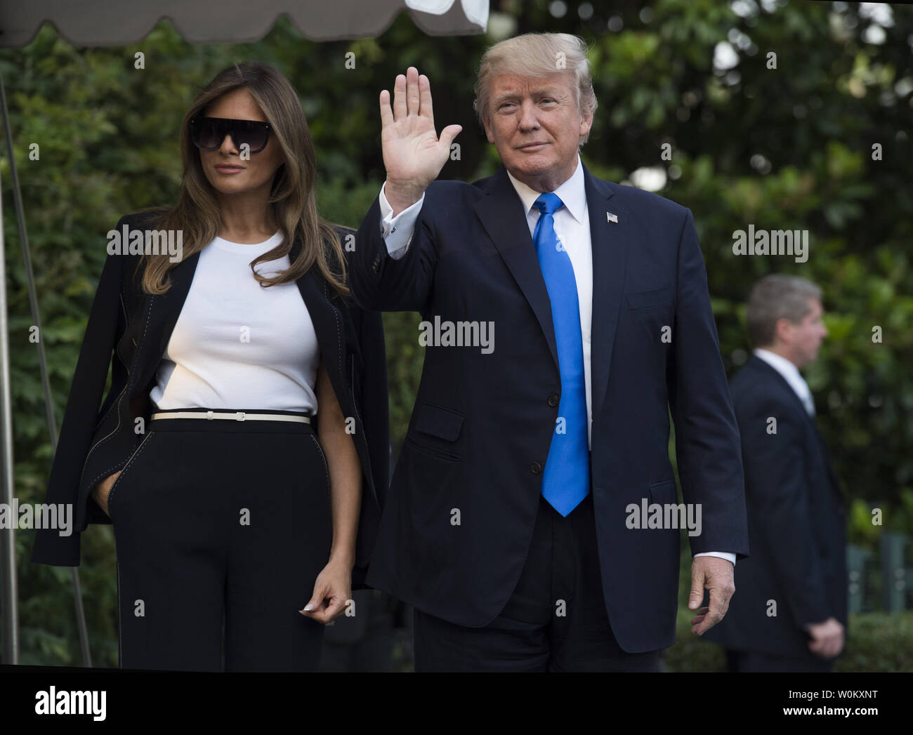 President Donald Trump and first lady Melanie leave the White House to ...