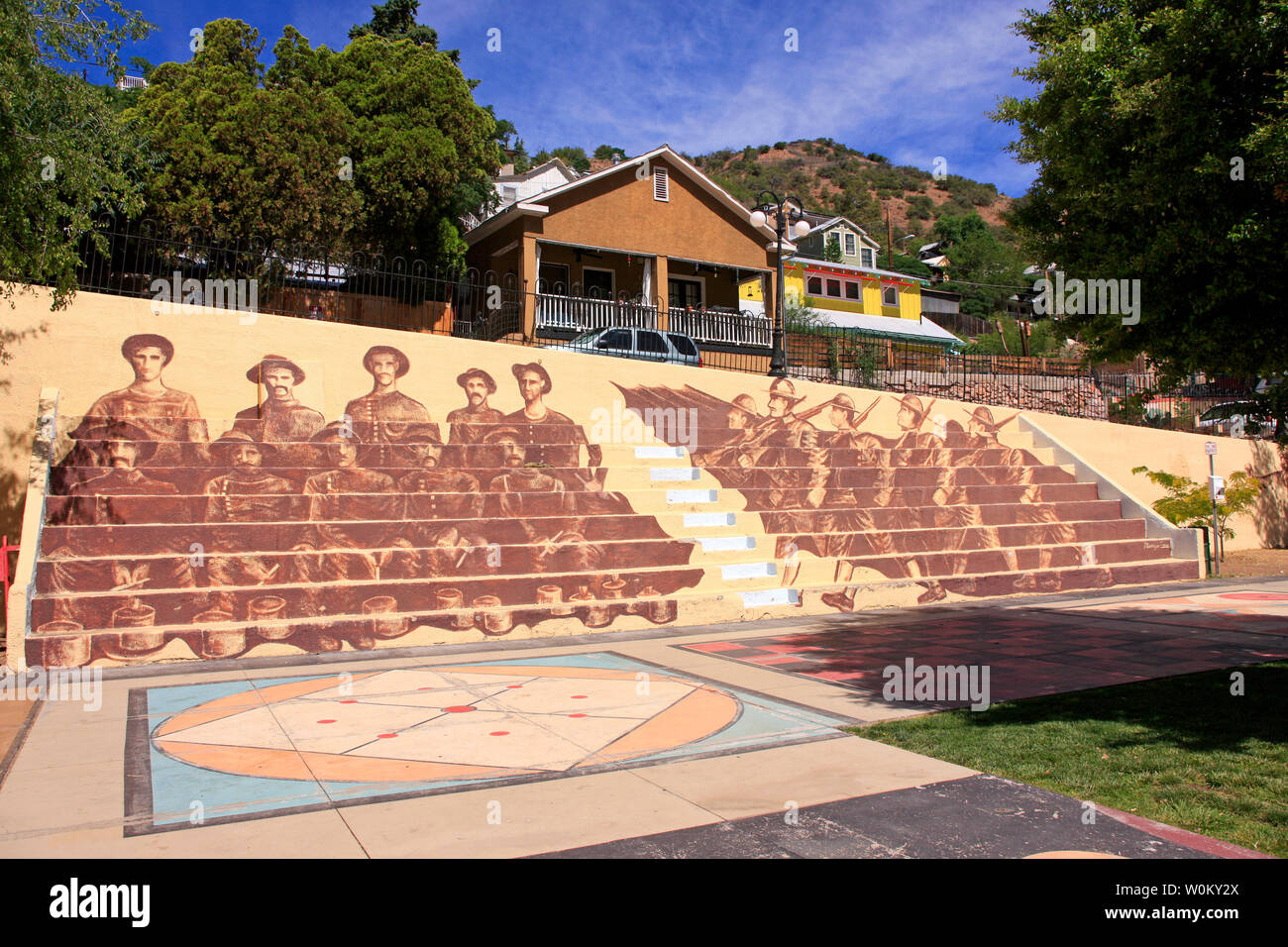 Painted mural of miners and soldiers from past times on the seating at ...
