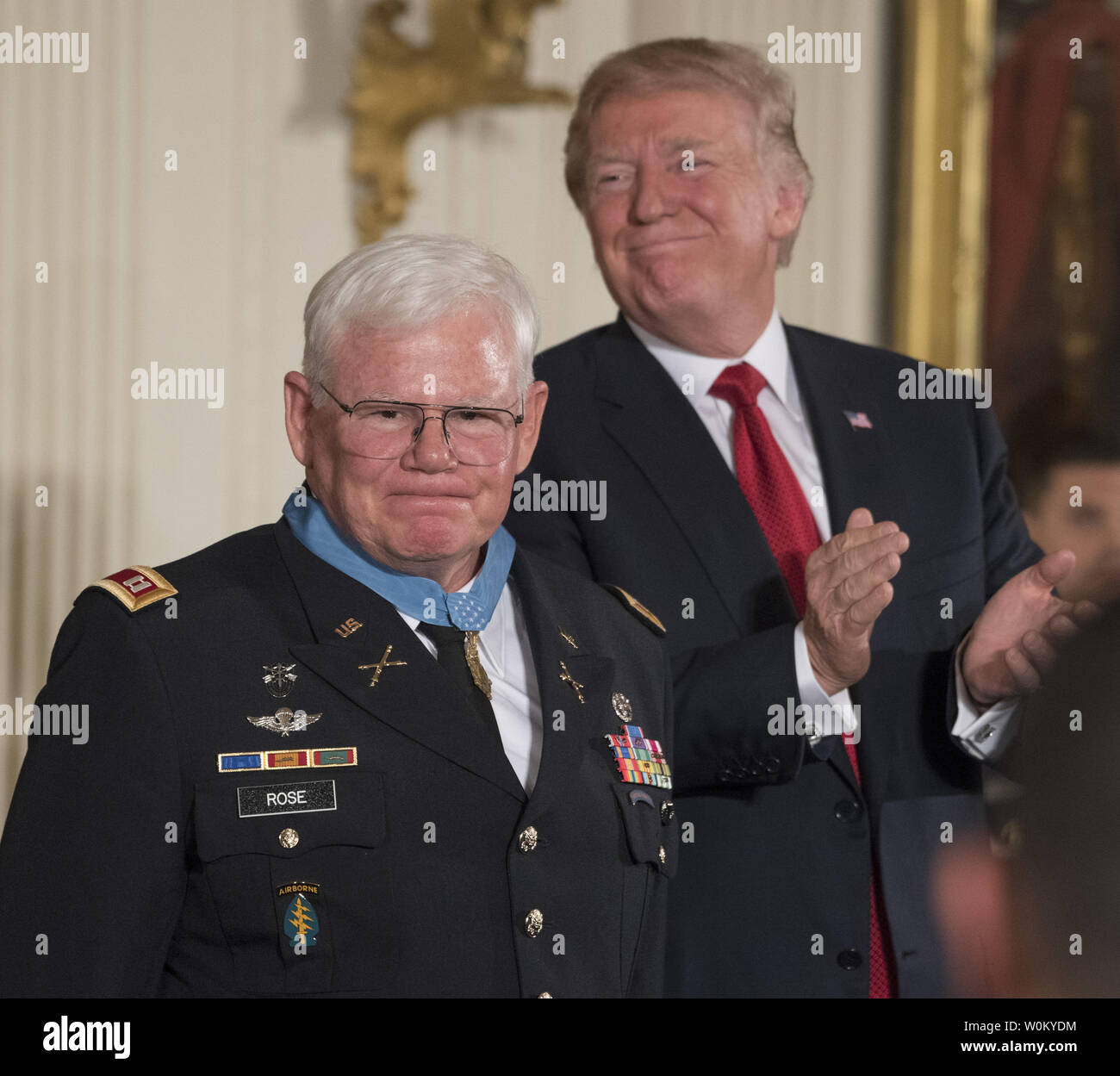 U.S. President Donald Trump applauds after presenting the Medal of ...