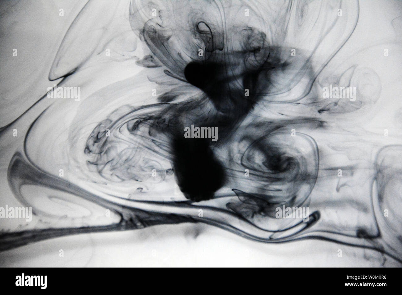 Ink background, ink flowing in water Stock Photo - Alamy