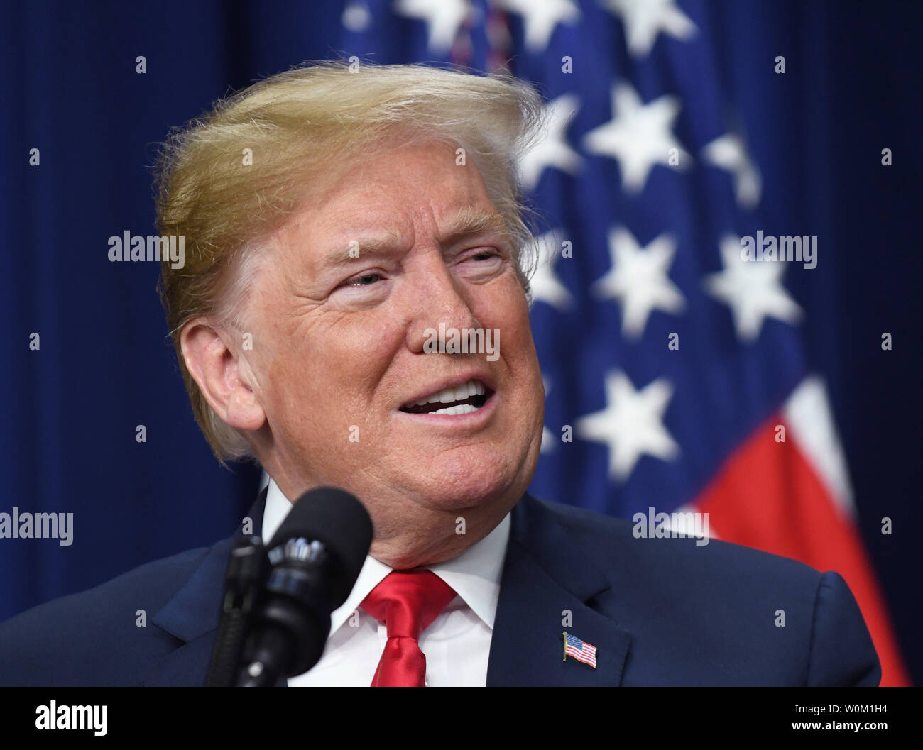 U.S. President Donald Trump smiles as he makes remarks at a "Face-to ...