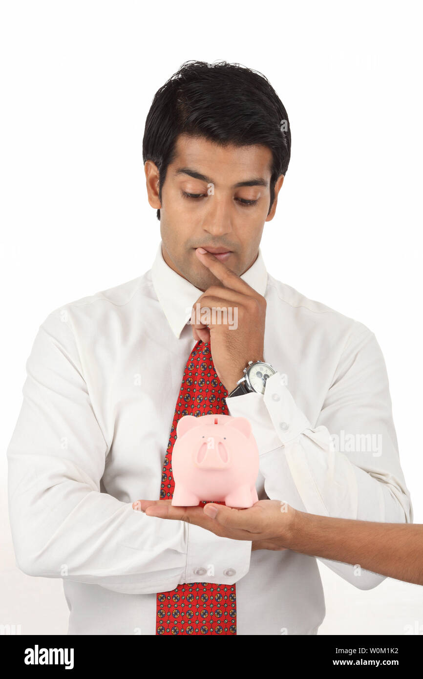 Indian businessman looking confused Stock Photo - Alamy