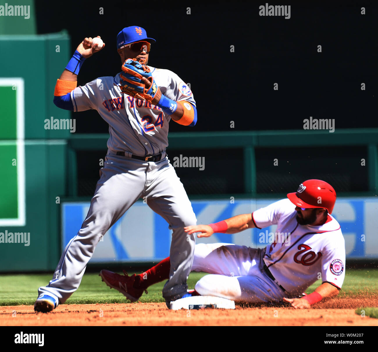 New York Mets Robinson Cano steps on second and throws home to get ...