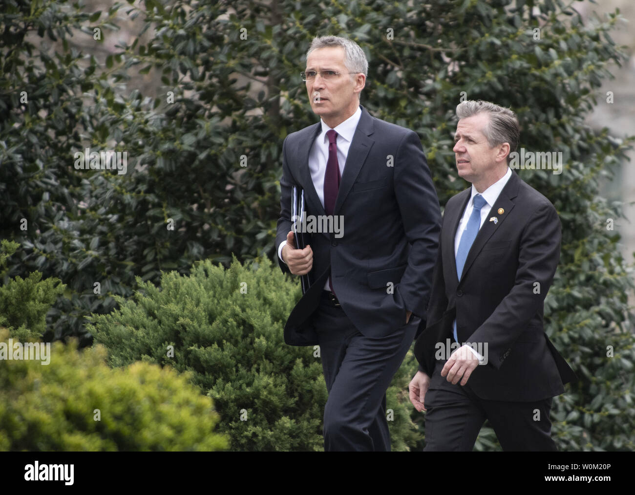 NATO Secretary General Jens Stoltenberg (L) arrives for a meeting with ...