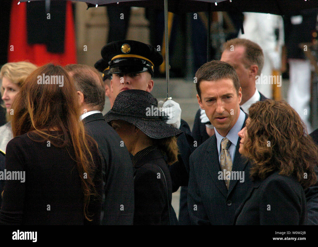 Ron Reagan speaks to his wife while family members leave the National ...