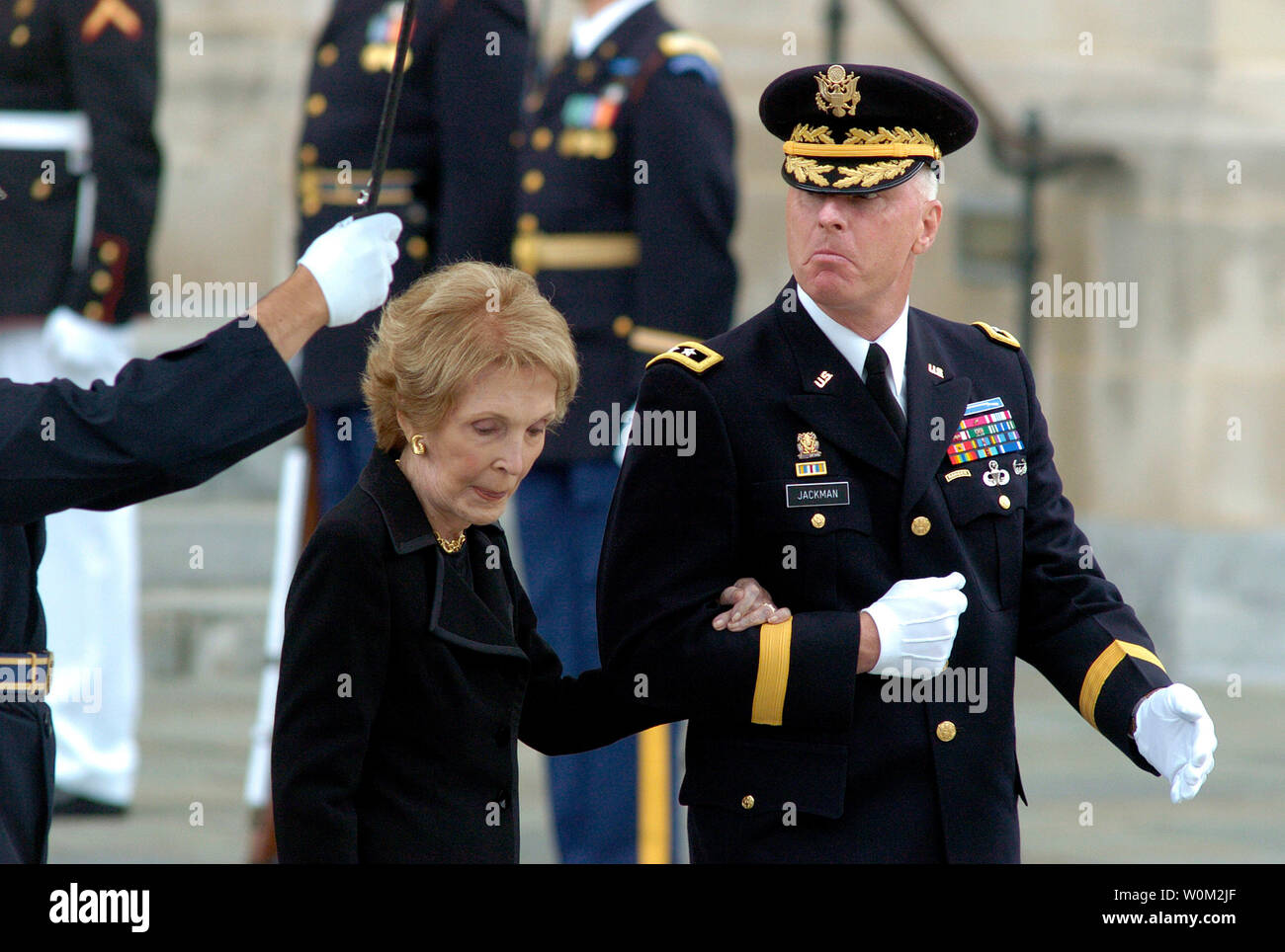 Nancy Reagan passes with her escort Major General Galen B. Jackman ...