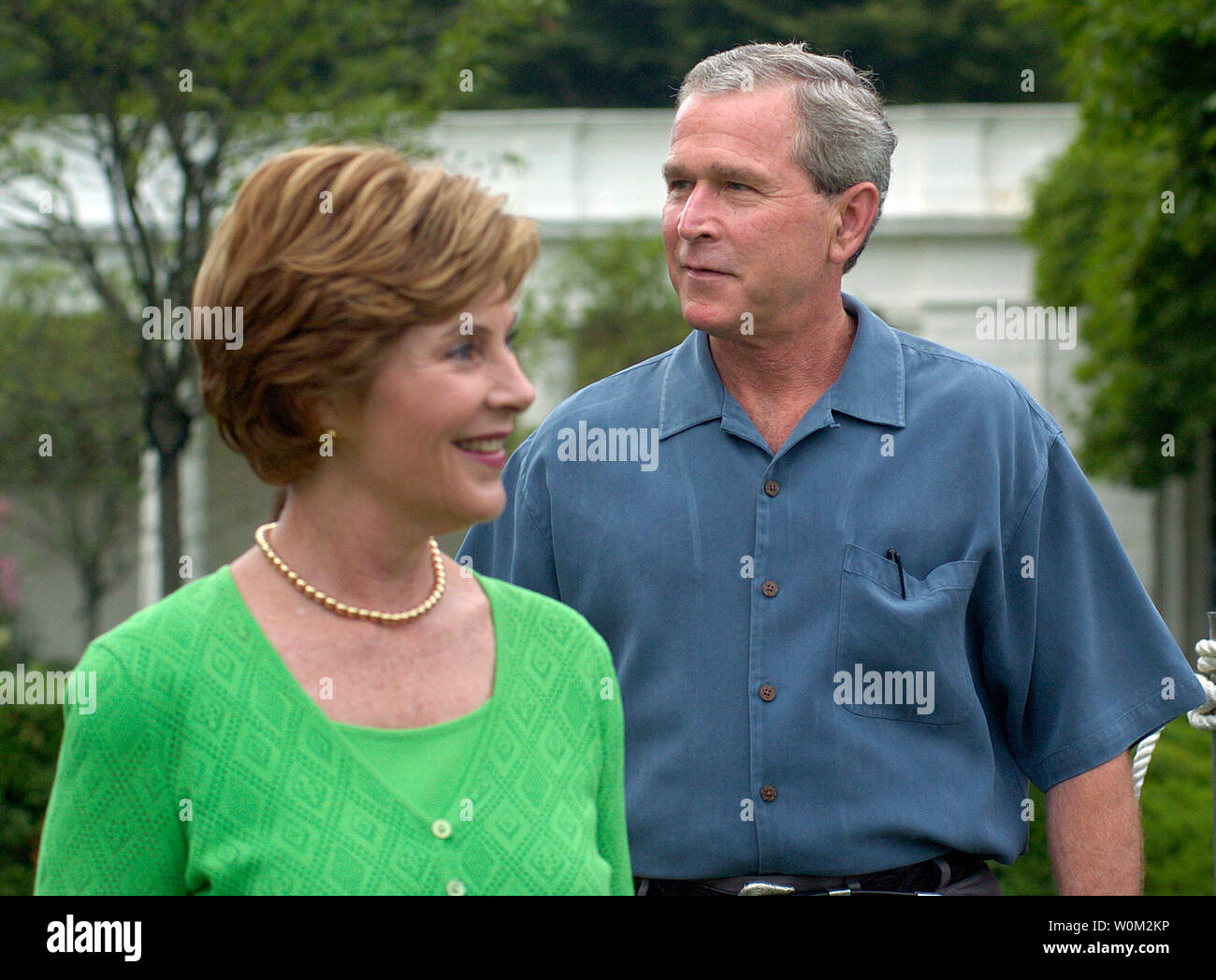 President George W. Bush and First Lady Laura Bush welcome guests to ...