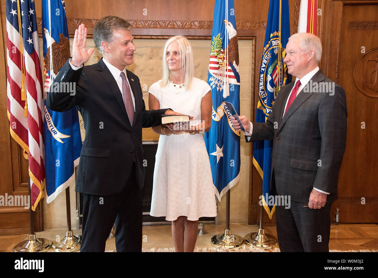 FBI Director Chris Wray, accompanied by his wife, Helen Garrison Howell ...