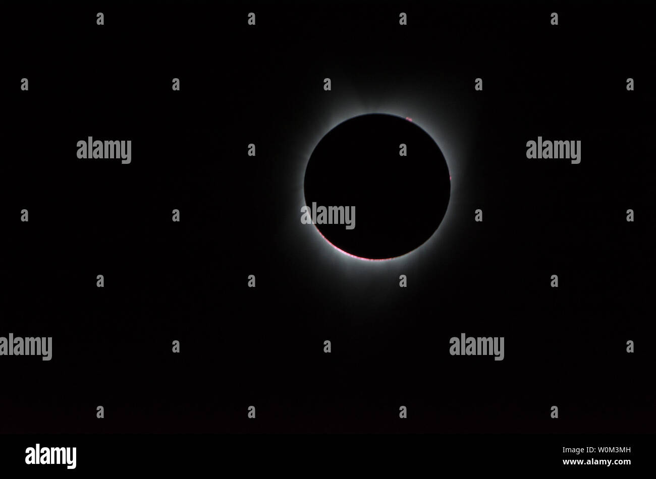 The SunÕs corona, only visible during the total eclipse, is shown as a ...