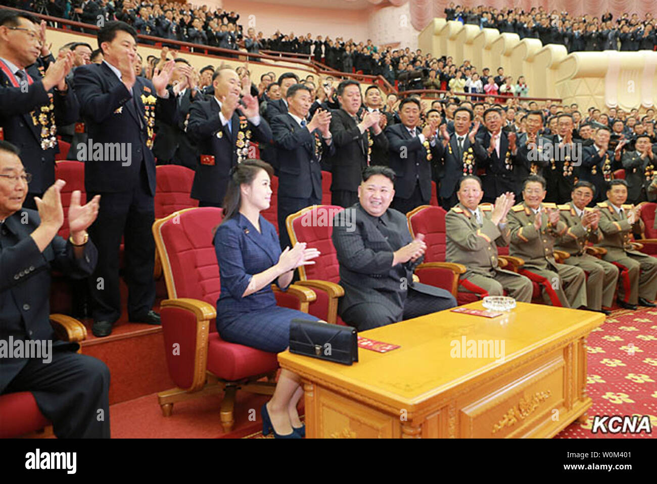 North Korean leader Kim Jong Un, accompanied by his wife, Ri Sol-Ju ...