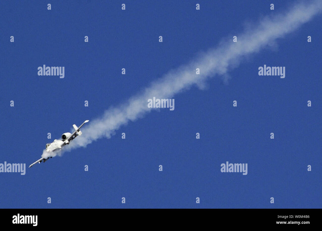 A United States Air Force A-10 from the 74th Fighter Squadron fires its ...