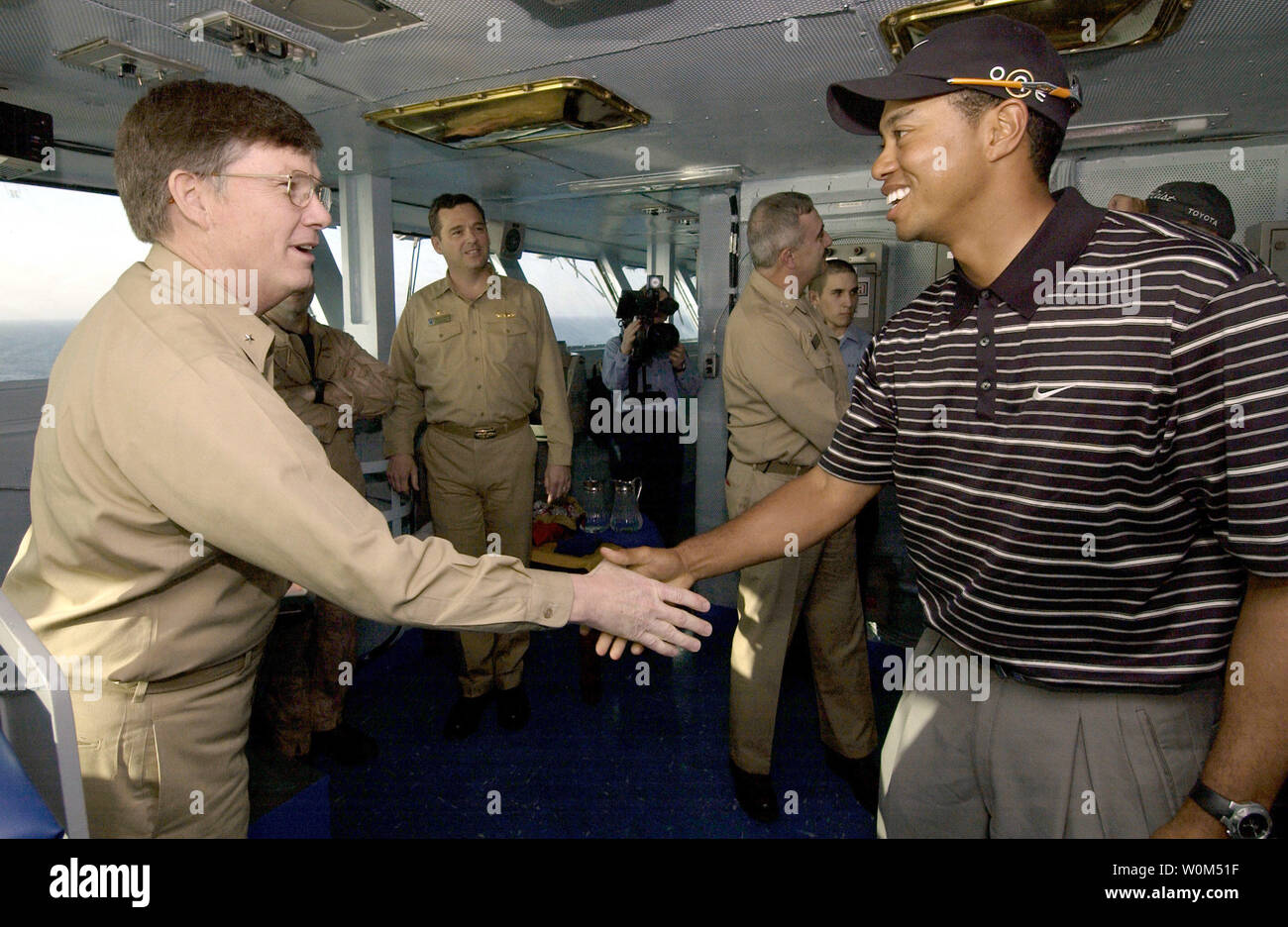 Tiger Woods meets Commander Carrier Group Eight (CCG-8) Rear Adm. Denby ...