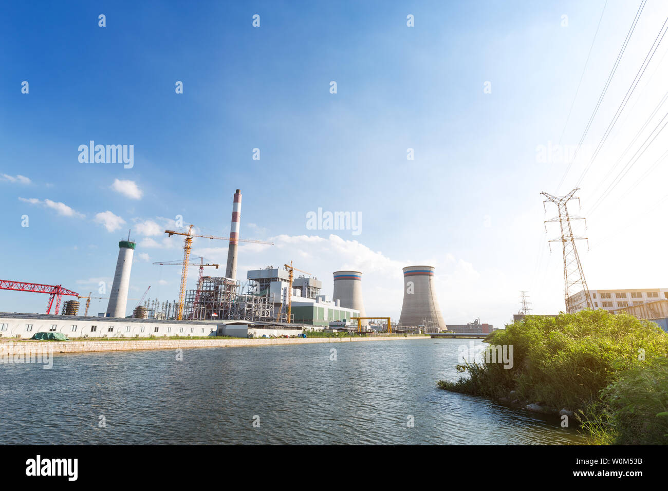 Modern power plant near water Stock Photo - Alamy