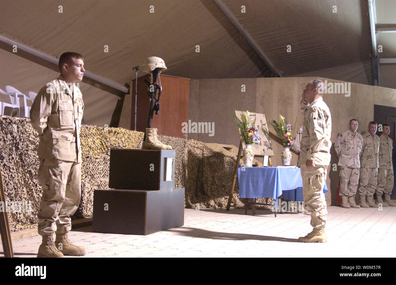 Military members honor PFC John D. Adams II during a Memorial Service ...