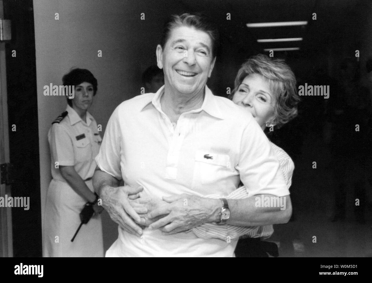 President Ronald Reagan is seen here getting a hug from his wife, Nancy ...