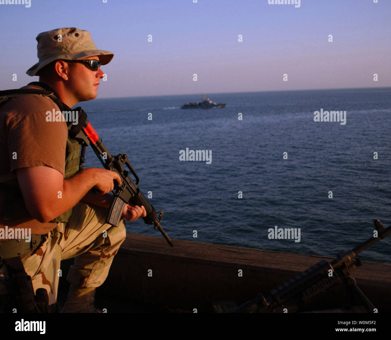 Engineman 2nd Class Joe Pearson stands watch on the north end of Al ...