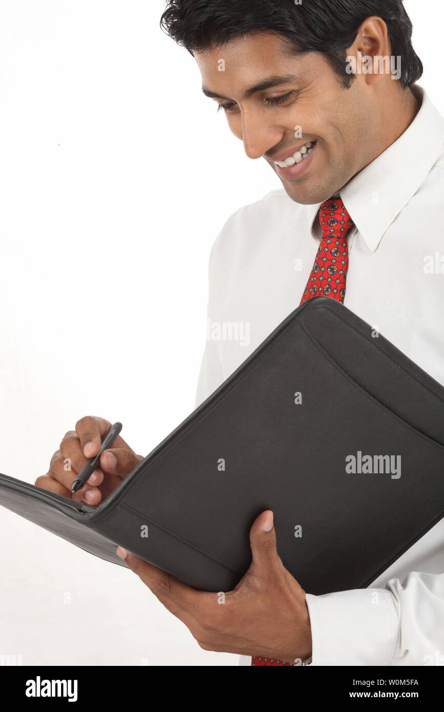 Indian businessman checking documents Stock Photo - Alamy