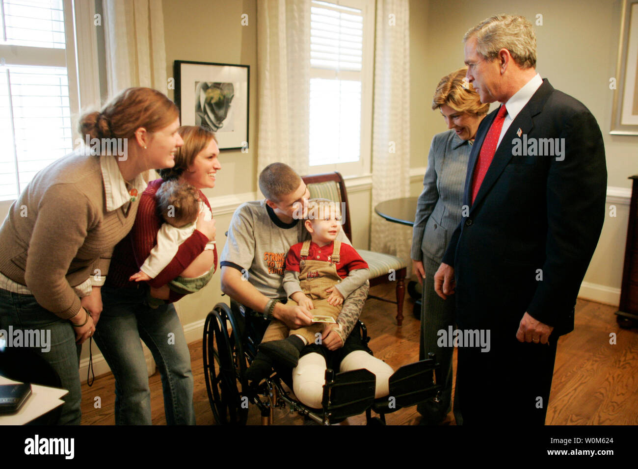 President George W. Bush and Laura Bush talk with U.S. Army Sgt. Dale ...