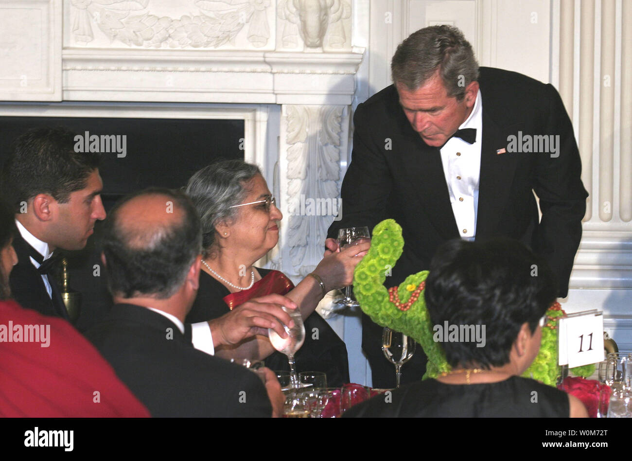 United States President George Bush toasts to Mrs. Gursharan Kaur, the ...