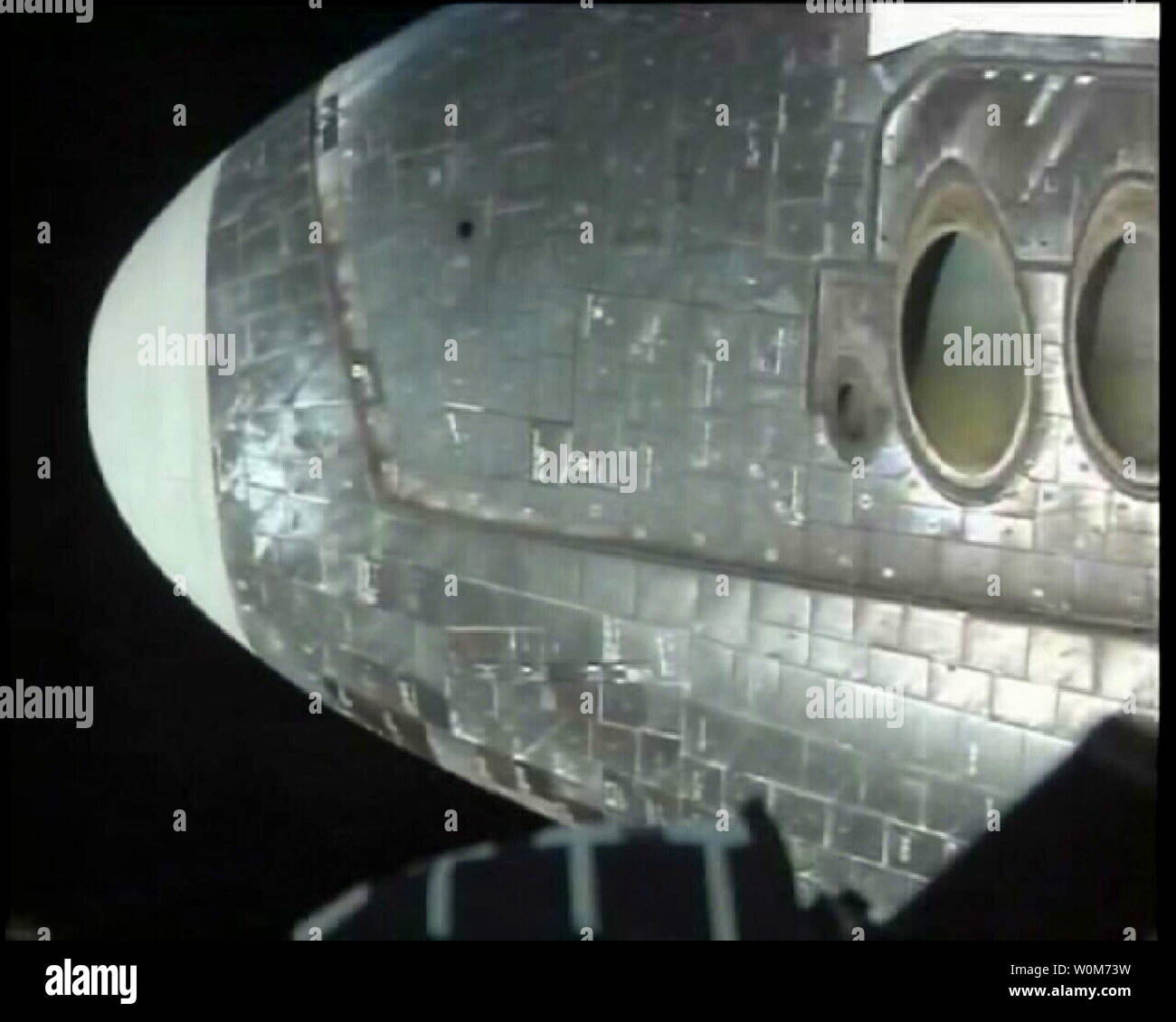 The nose of the Shuttle Discovery is shown 177 miles in space via a ...