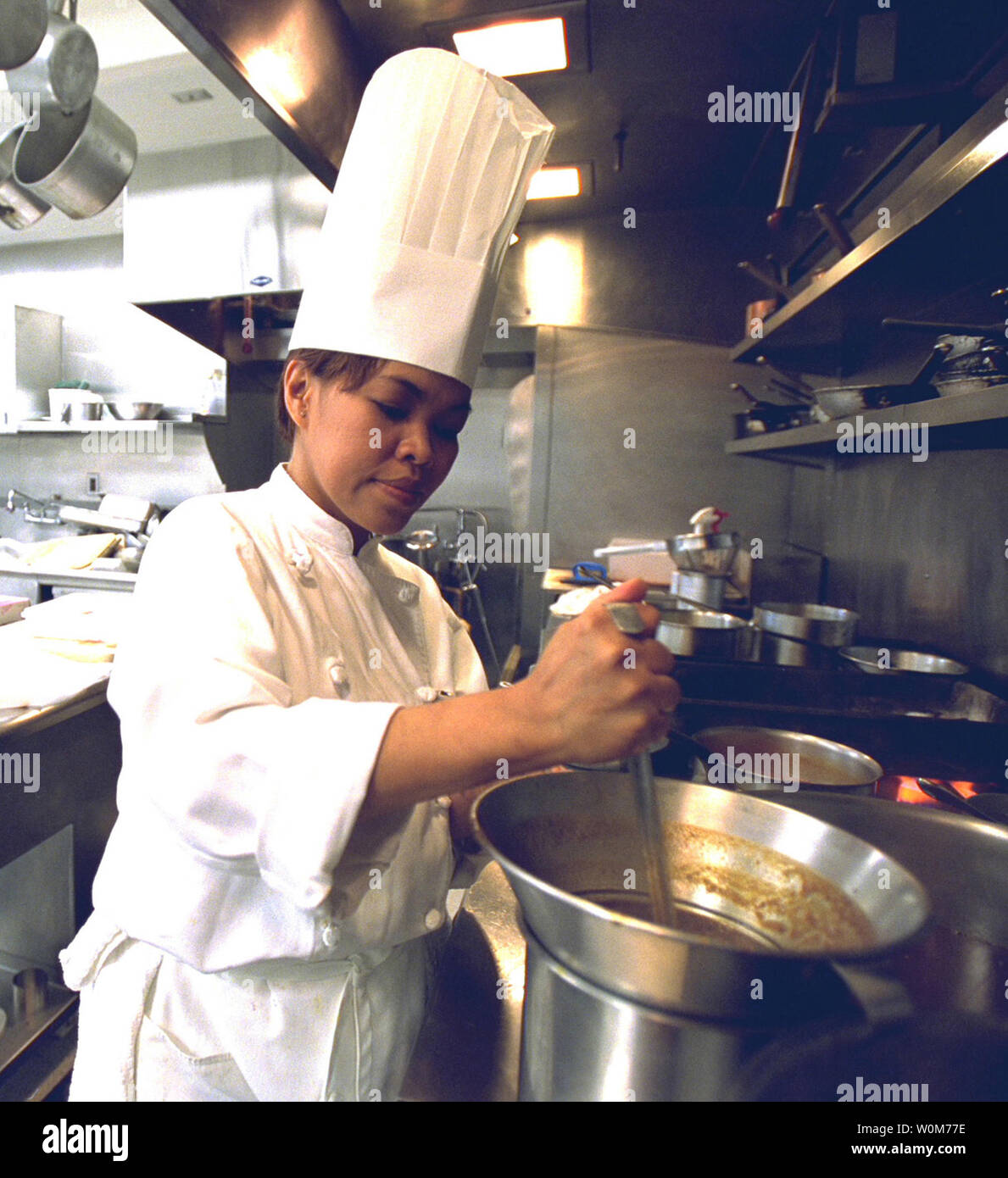 Chef Cristeta "Cris" Comerford prepares a meal inside the White House ...