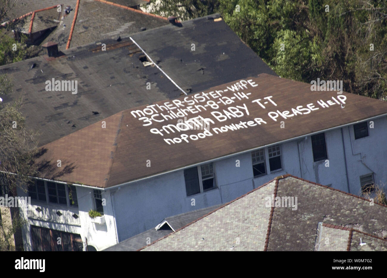 A rescue message is left on the roof of a home shorly after rescue ...