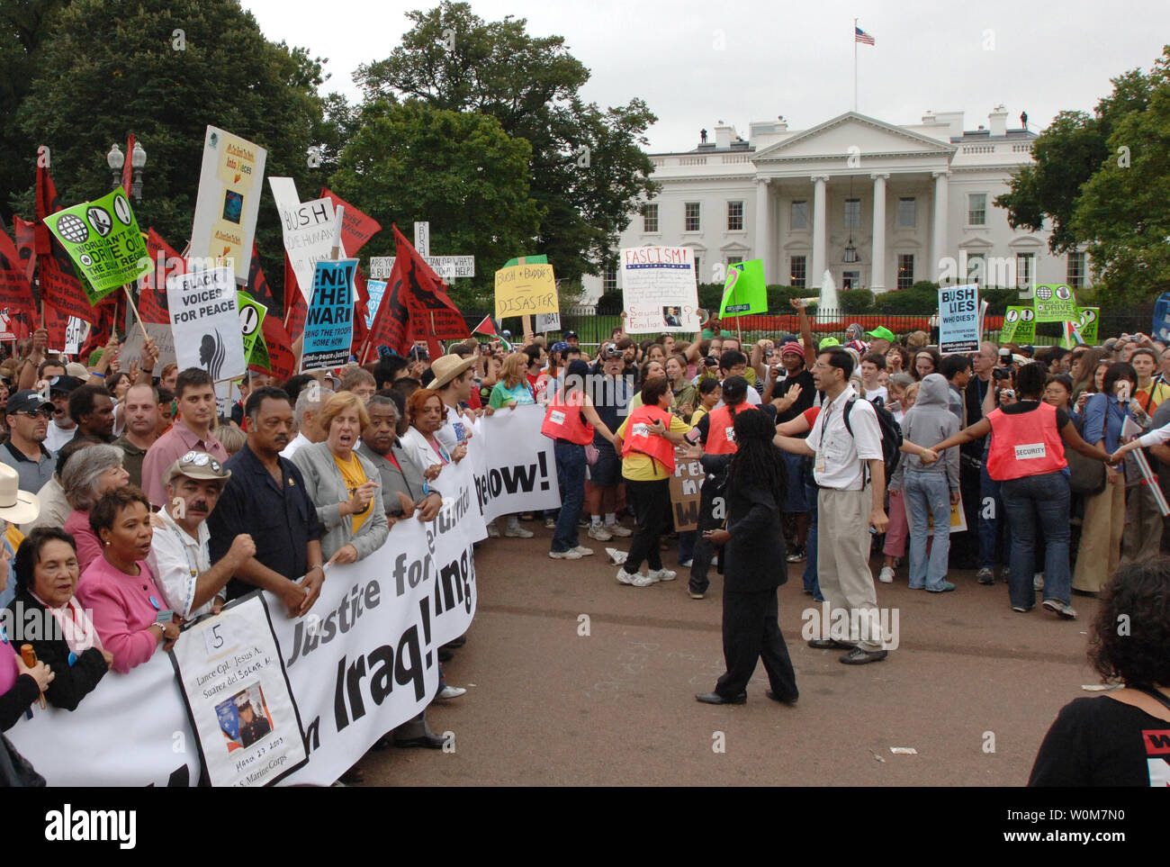 Cindy Sheehan and Rev. Jesse Jackson (L) lead an anti-war march in ...